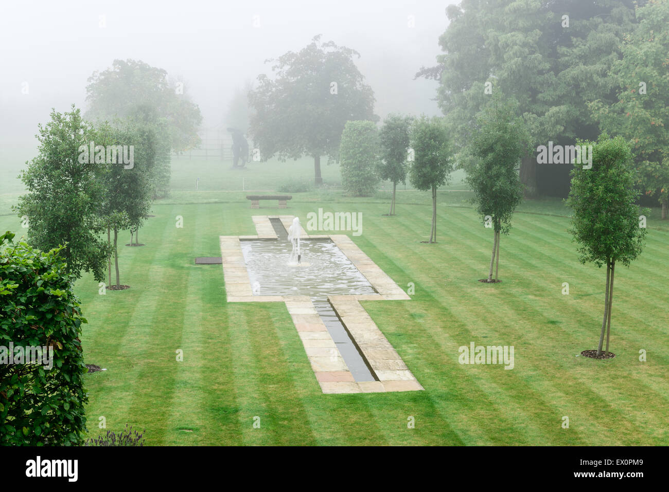 View looking down to lawn with cross-shaped pond and fountain Stock ...