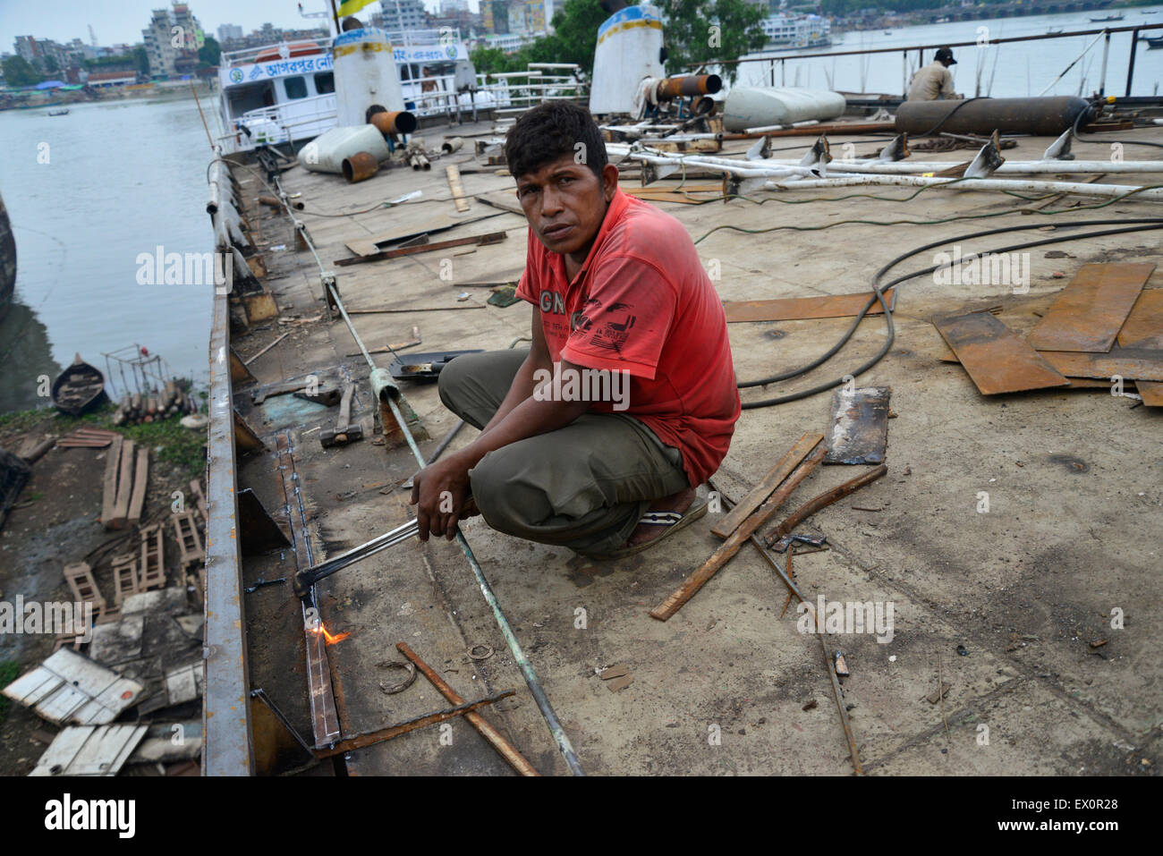 Shipyard workers near the Buriganga River in Dhaka. About 15,000 people ...