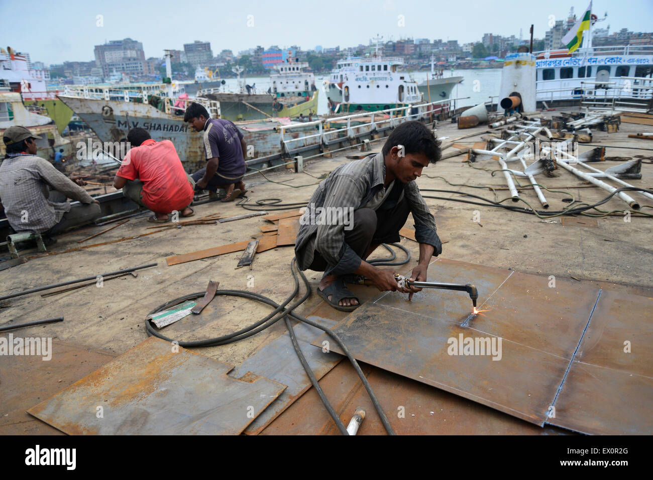 Shipyard workers near the Buriganga River in Dhaka. About 15,000 people ...