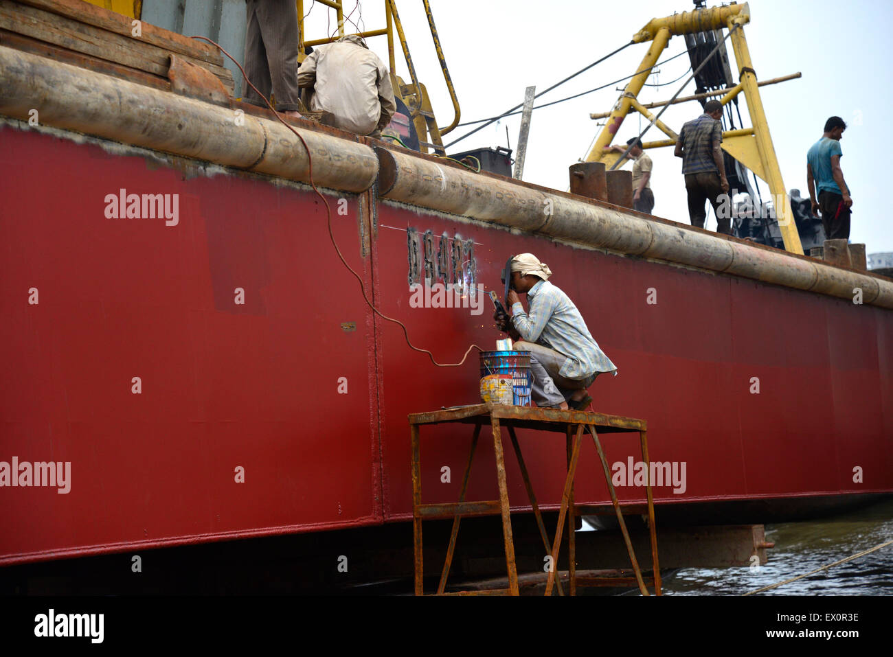 Shipyard workers near the Buriganga River in Dhaka. About 15,000 people ...
