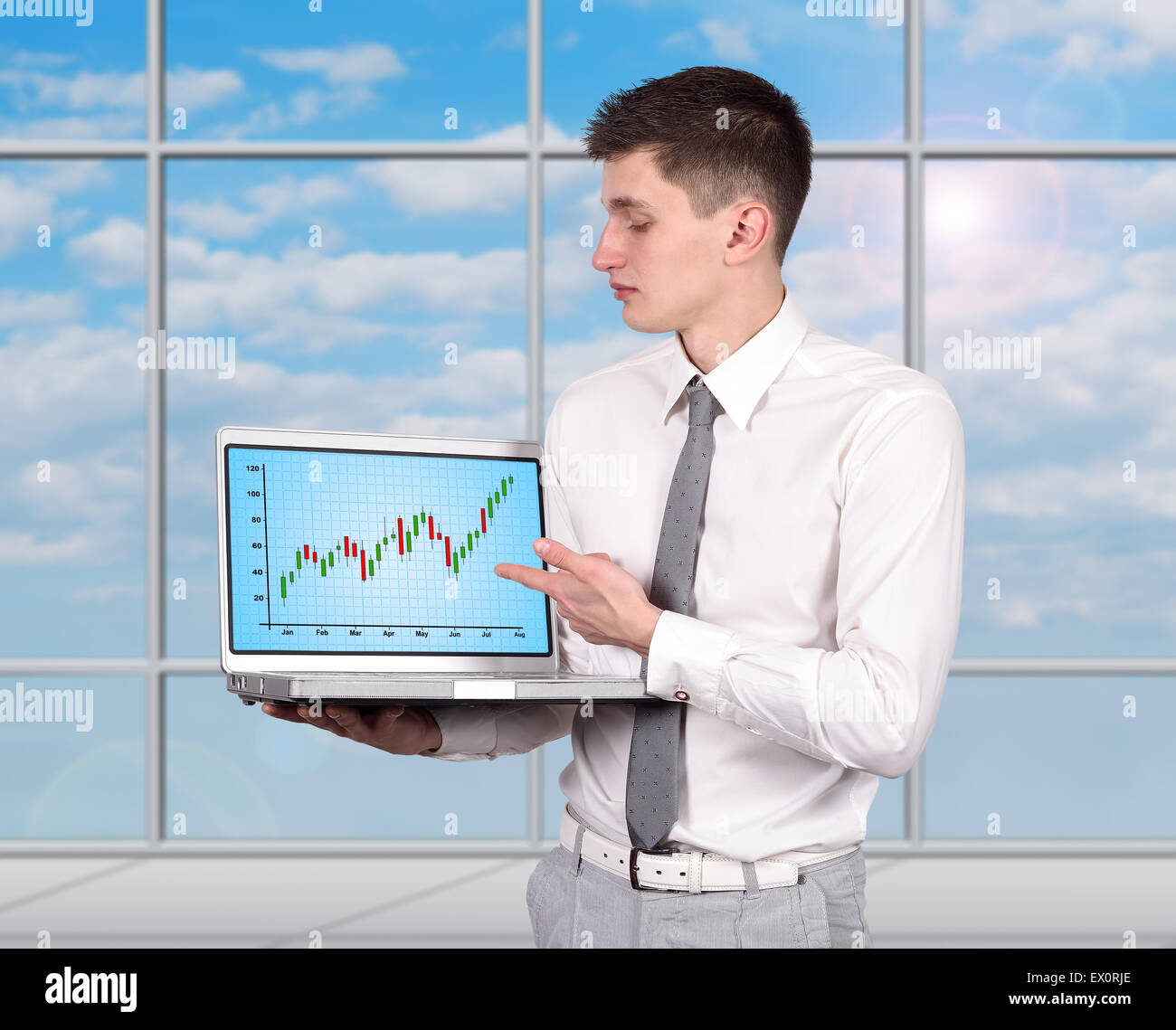 businessman holding laptop with stock chart, close up Stock Photo - Alamy