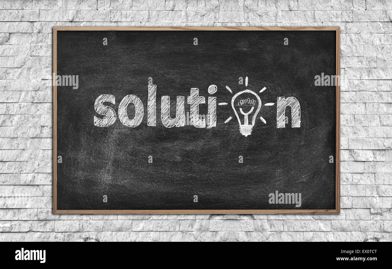 chalk board with solution on brick wall, close up Stock Photo - Alamy