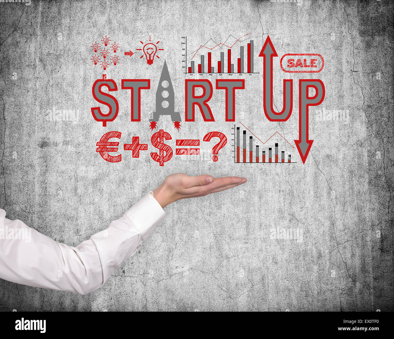 hand holding start up on gray wall background Stock Photo - Alamy
