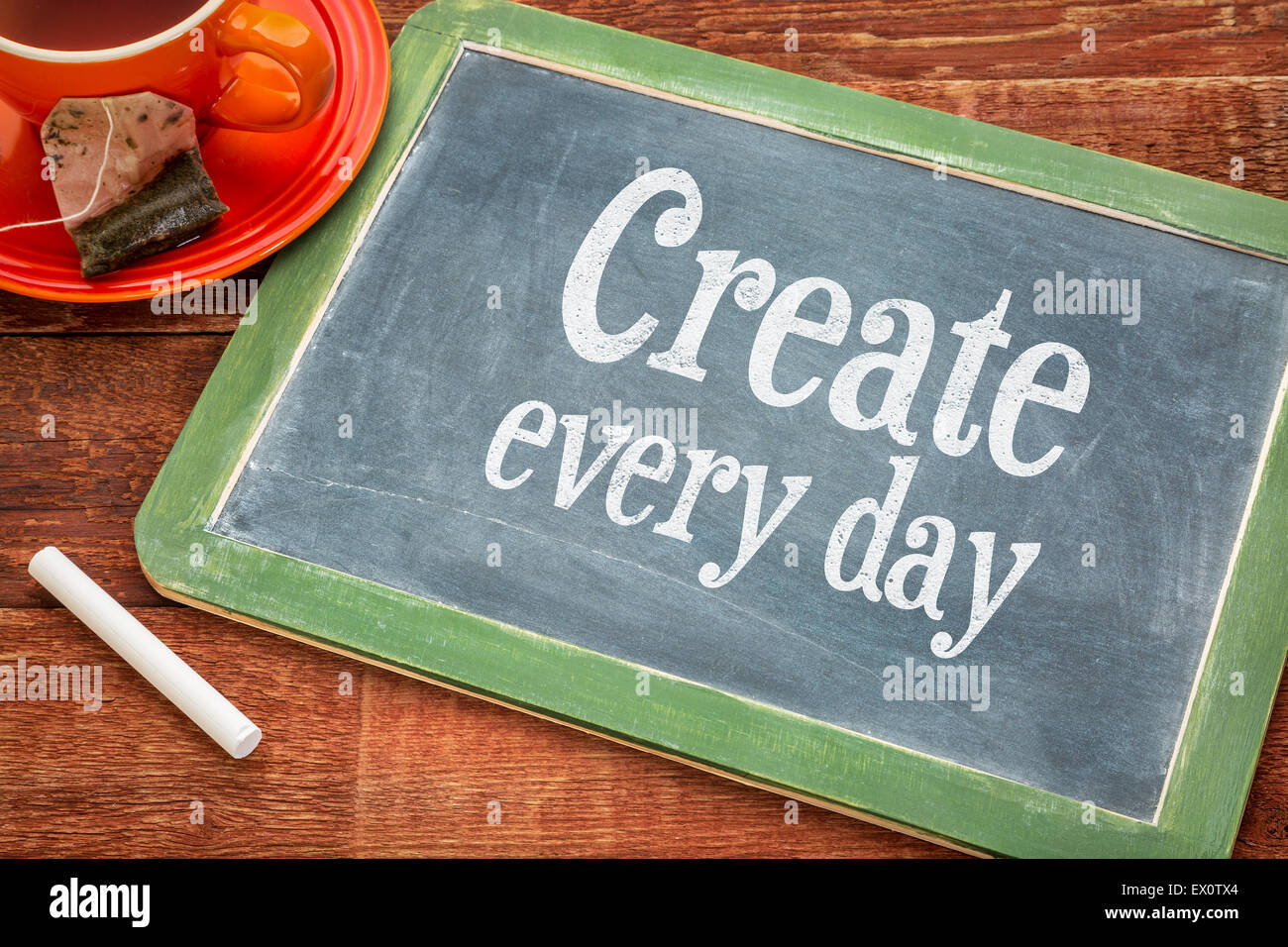 Create every day motivational reminder - motivational text on a slate blackboard with chalk and ...