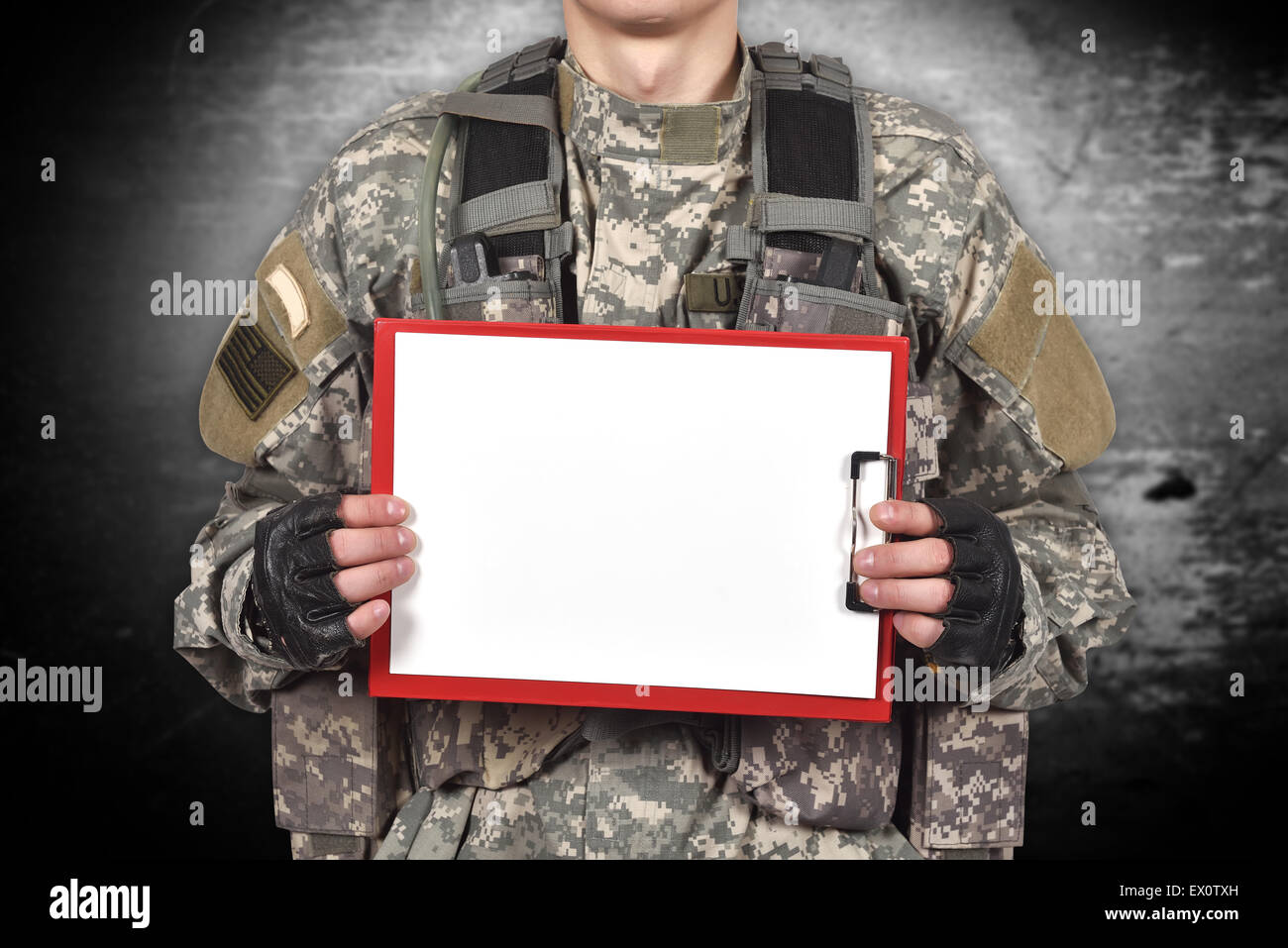 american soldier holding blank clipboard on a gray background Stock ...