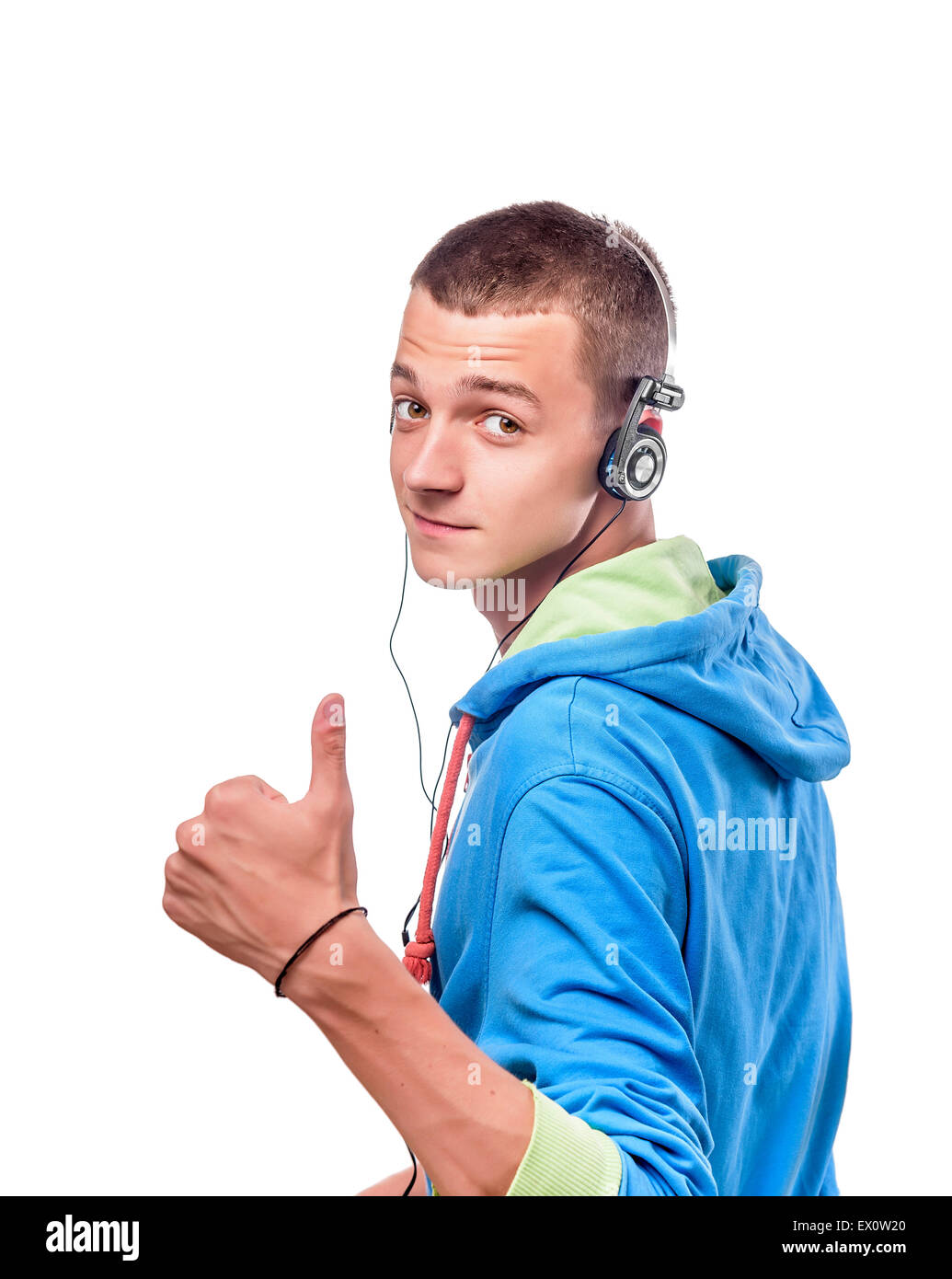Guy using phone with headphones Stock Photo - Alamy