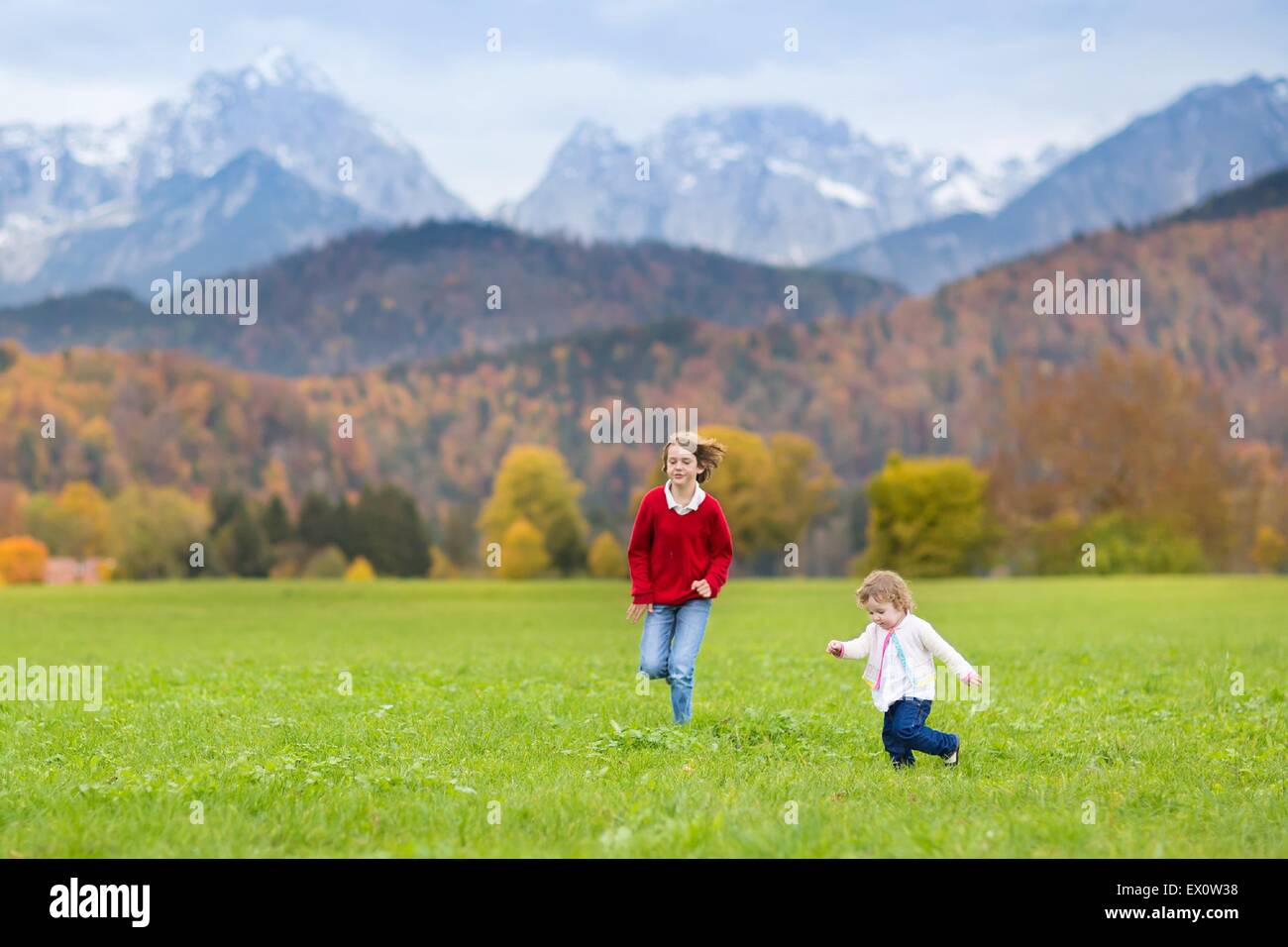 Happy family baby running field hi-res stock photography and images - Alamy