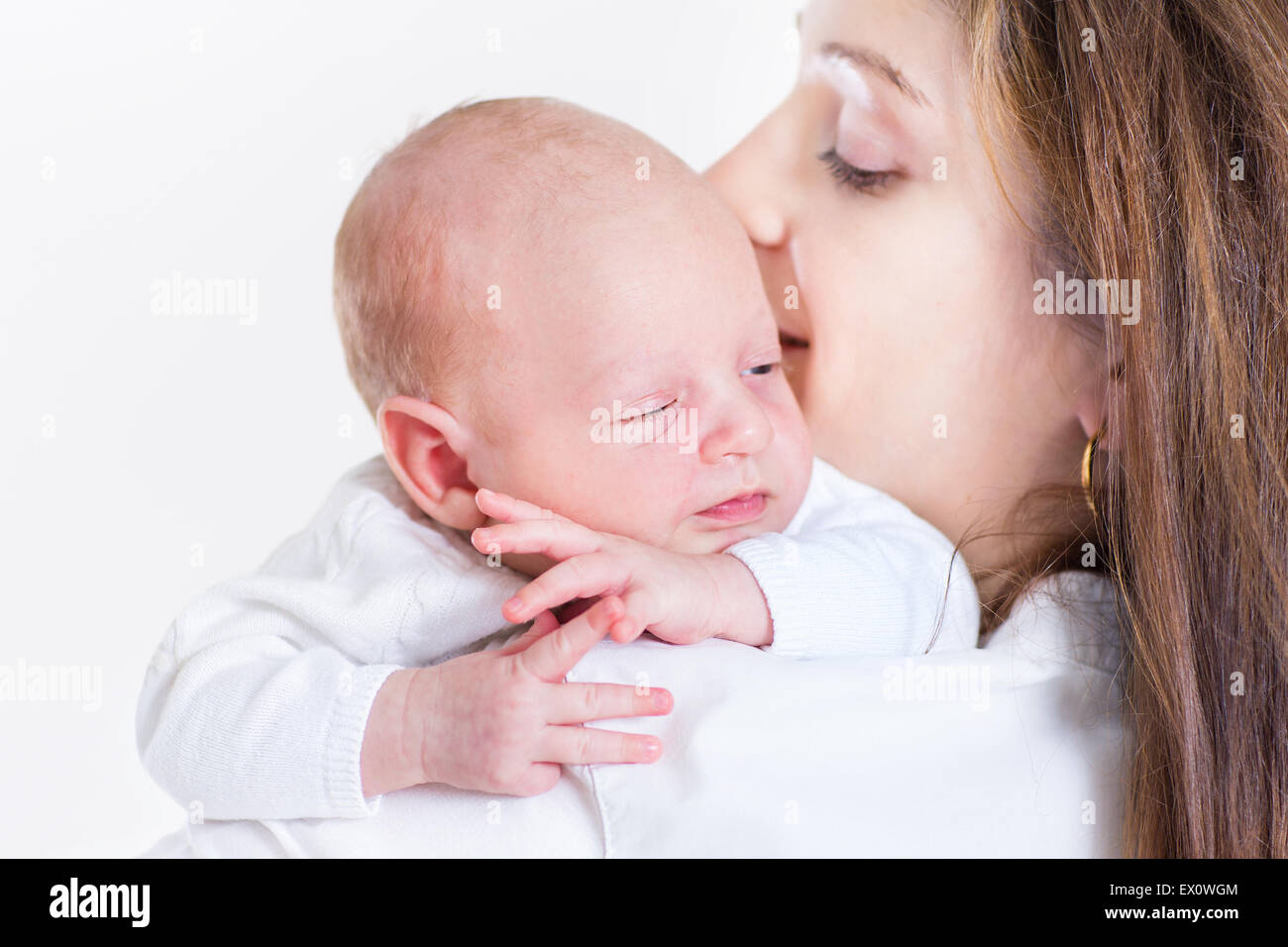 Beautiful young mother holding her sweet newborn baby Stock Photo - Alamy