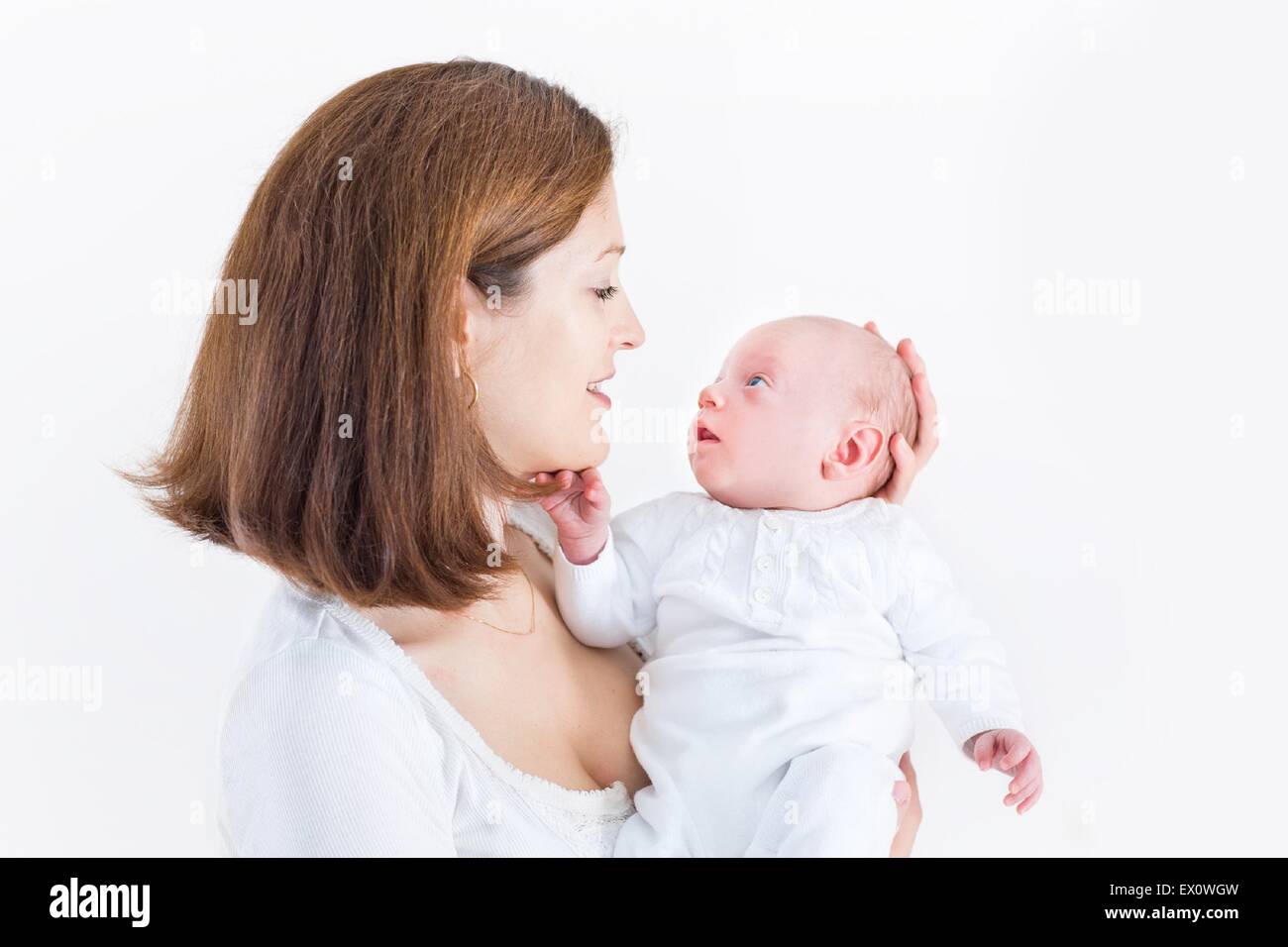 Beautiful young mother holding her sweet newborn baby Stock Photo - Alamy