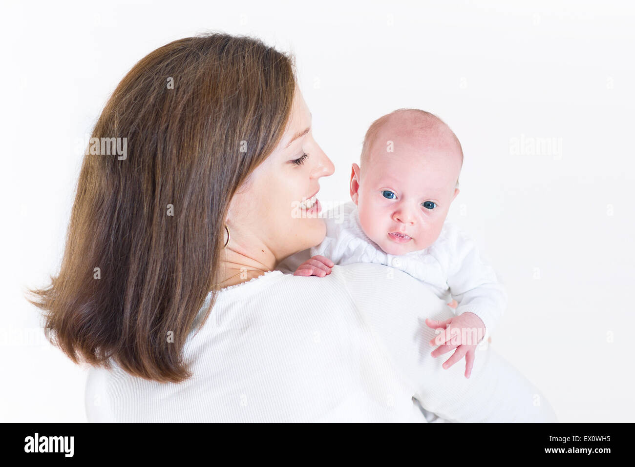 Beautiful young mother holding her sweet newborn baby Stock Photo - Alamy