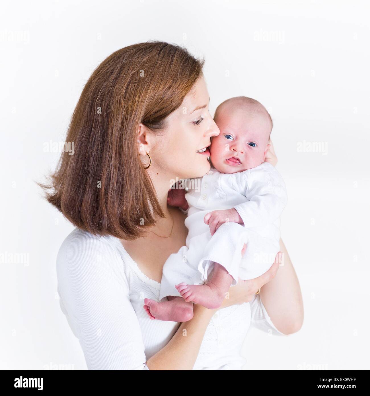 Beautiful young mother holding her sweet newborn baby Stock Photo - Alamy
