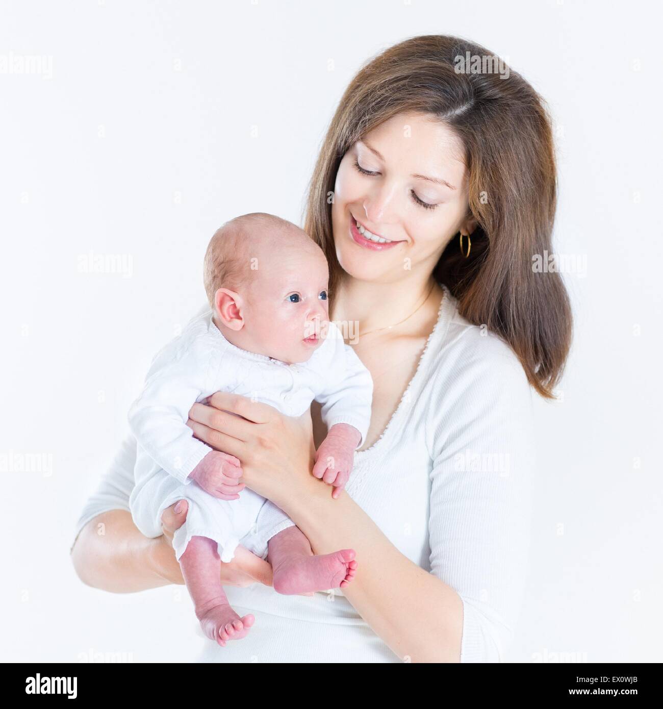 Beautiful young mother holding her sweet newborn baby Stock Photo - Alamy