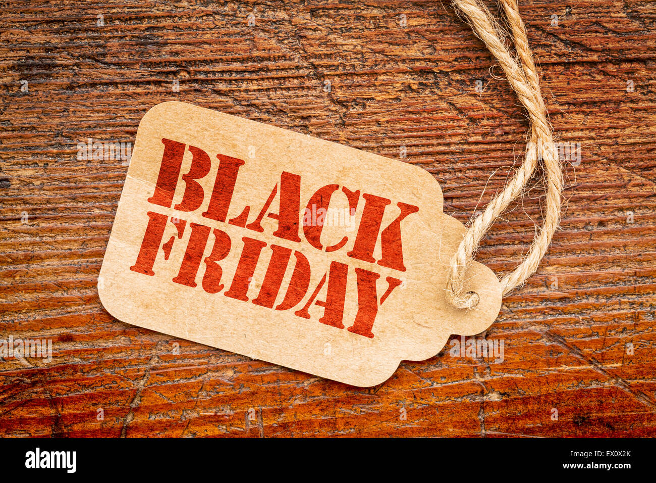 Black Friday sign a paper price tag against rustic red painted barn ...