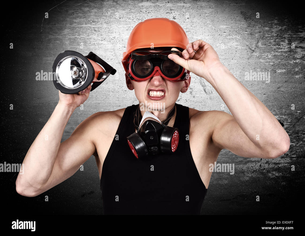 worker with flashlight in biohazard mask on black background Stock ...