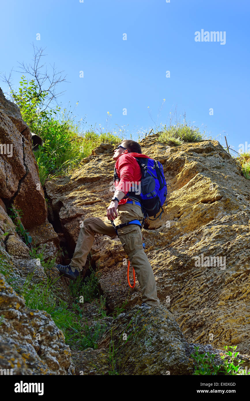 Man climber backpack climbing rock hi-res stock photography and images ...