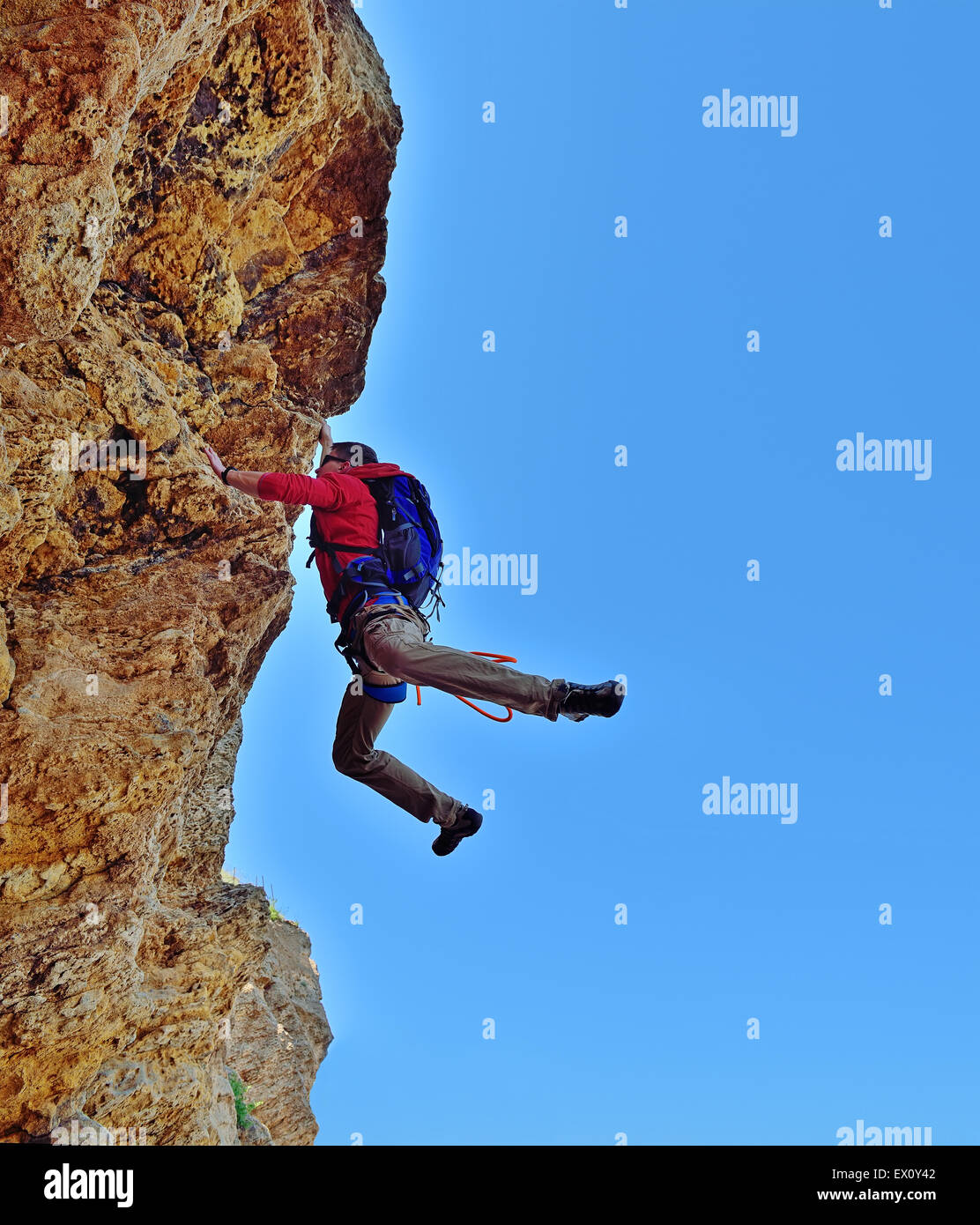young climber with backpack fell from a cliff Stock Photo - Alamy