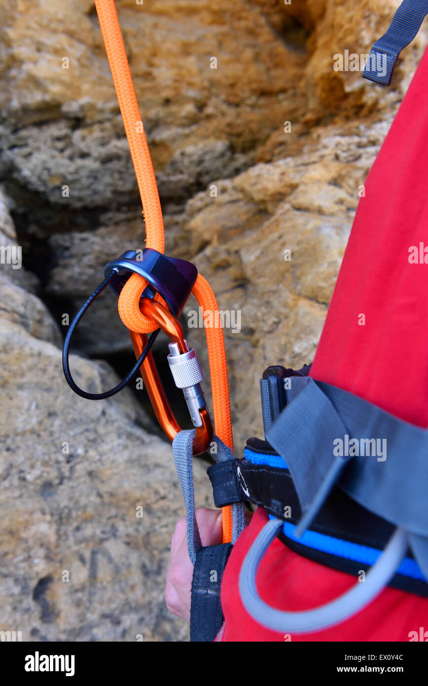 climber man belay rope is threaded through the carabiner Stock Photo ...