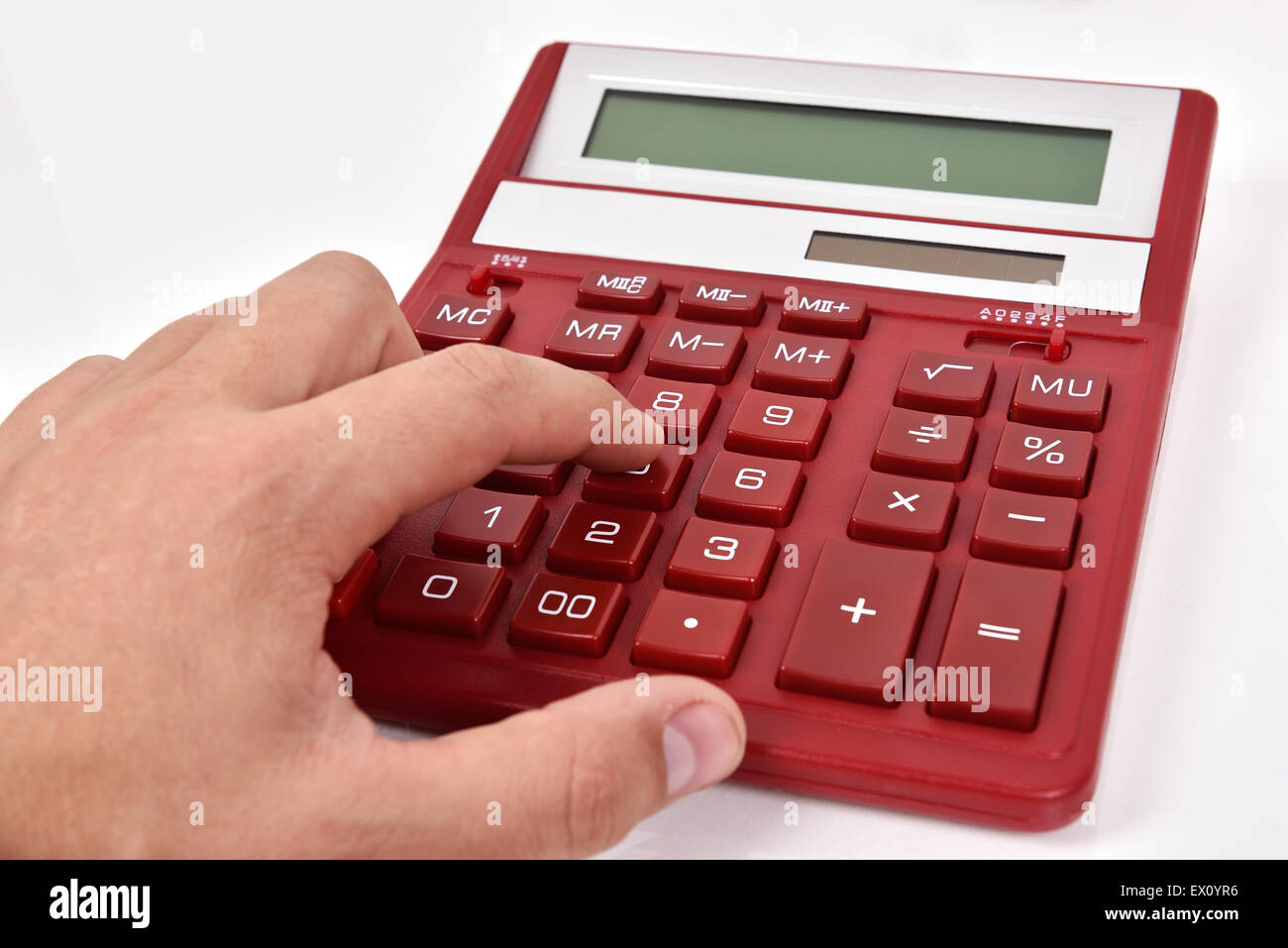accountant hand pushing red calculator close up Stock Photo - Alamy