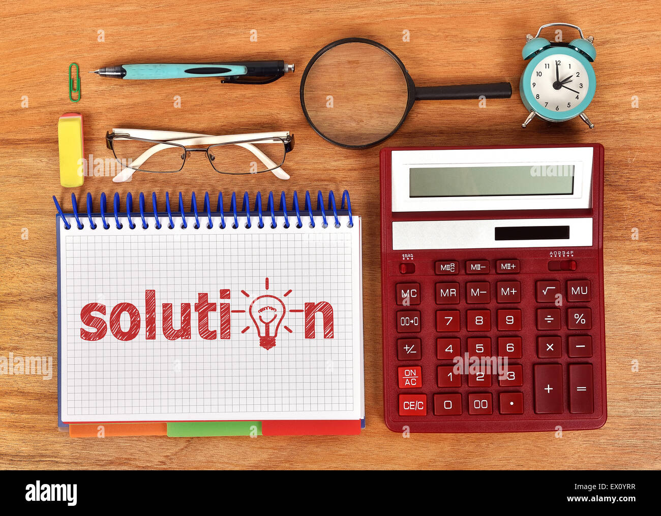 solution symbol in notebook and red calculator Stock Photo - Alamy