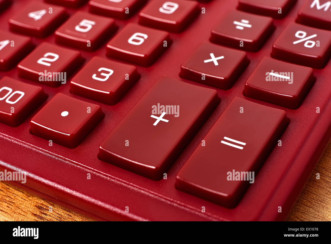 Red Calculator on table, extra close up Stock Photo - Alamy