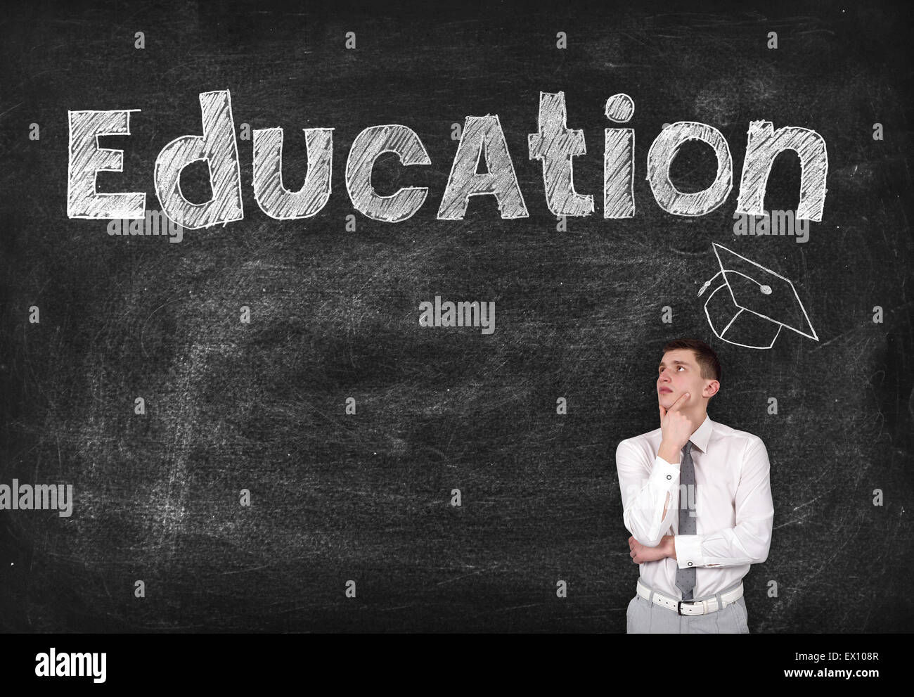 Young student thinking about education. Blackboard with drawing ...