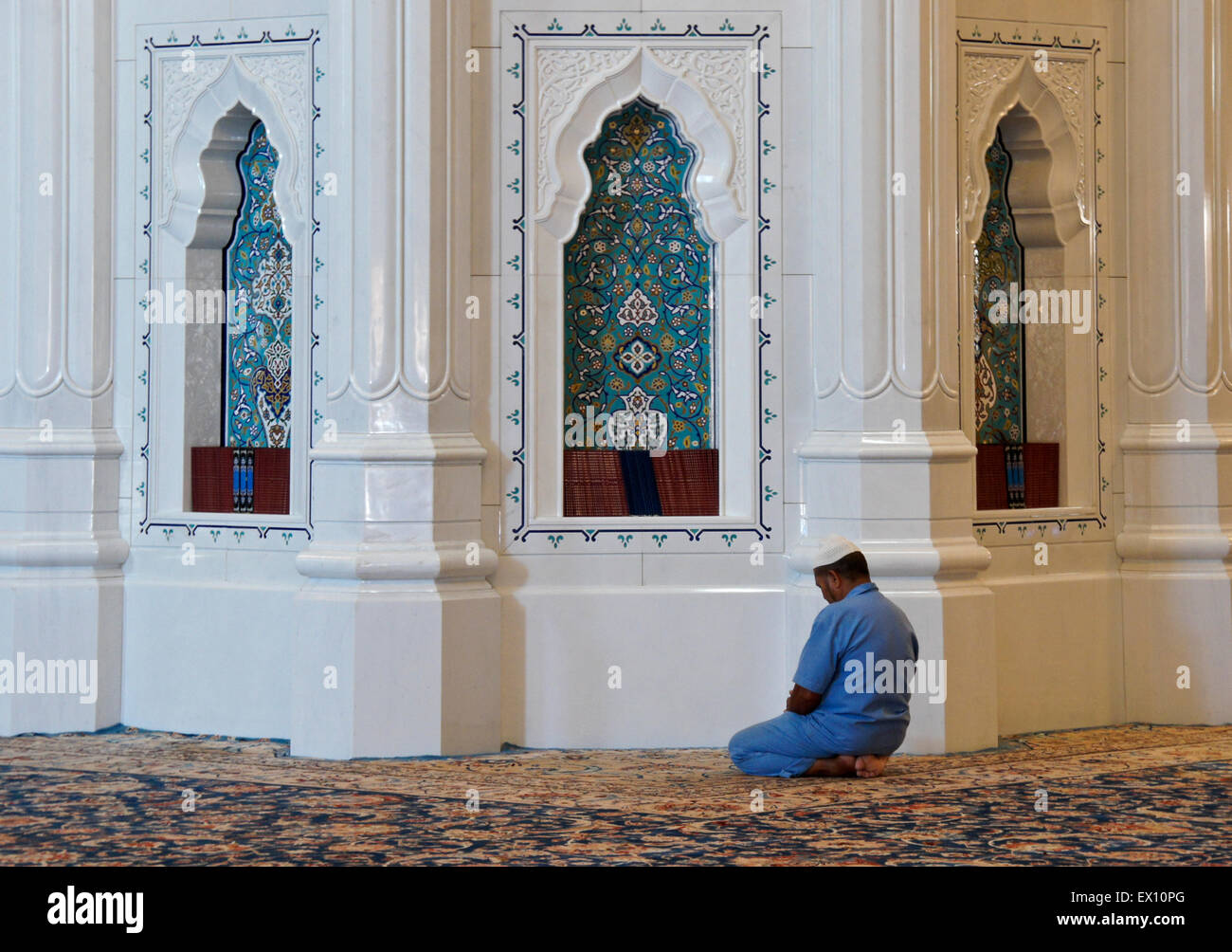 Muslim man praying, Sultan Qaboos Grand Mosque, Muscat, Oman Stock ...