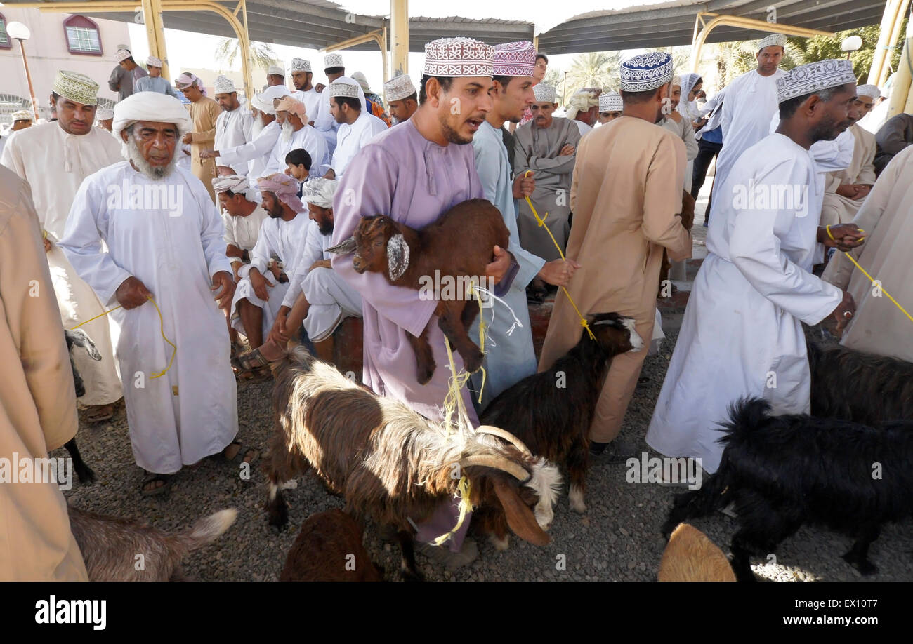 Buying and selling goats at weekly animal market in Nizwa, Oman Stock ...