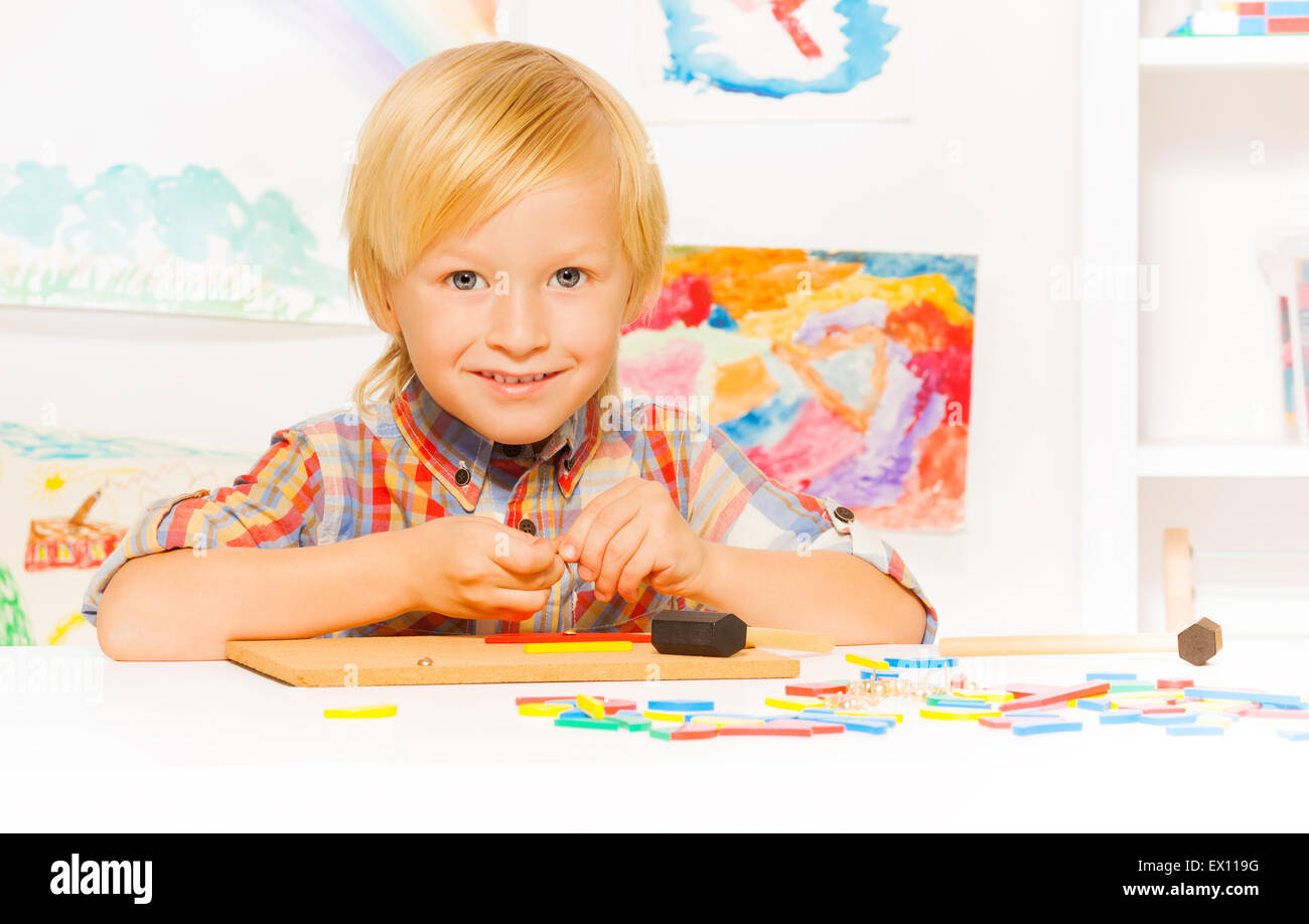Boy busy with developmental game Stock Photo - Alamy