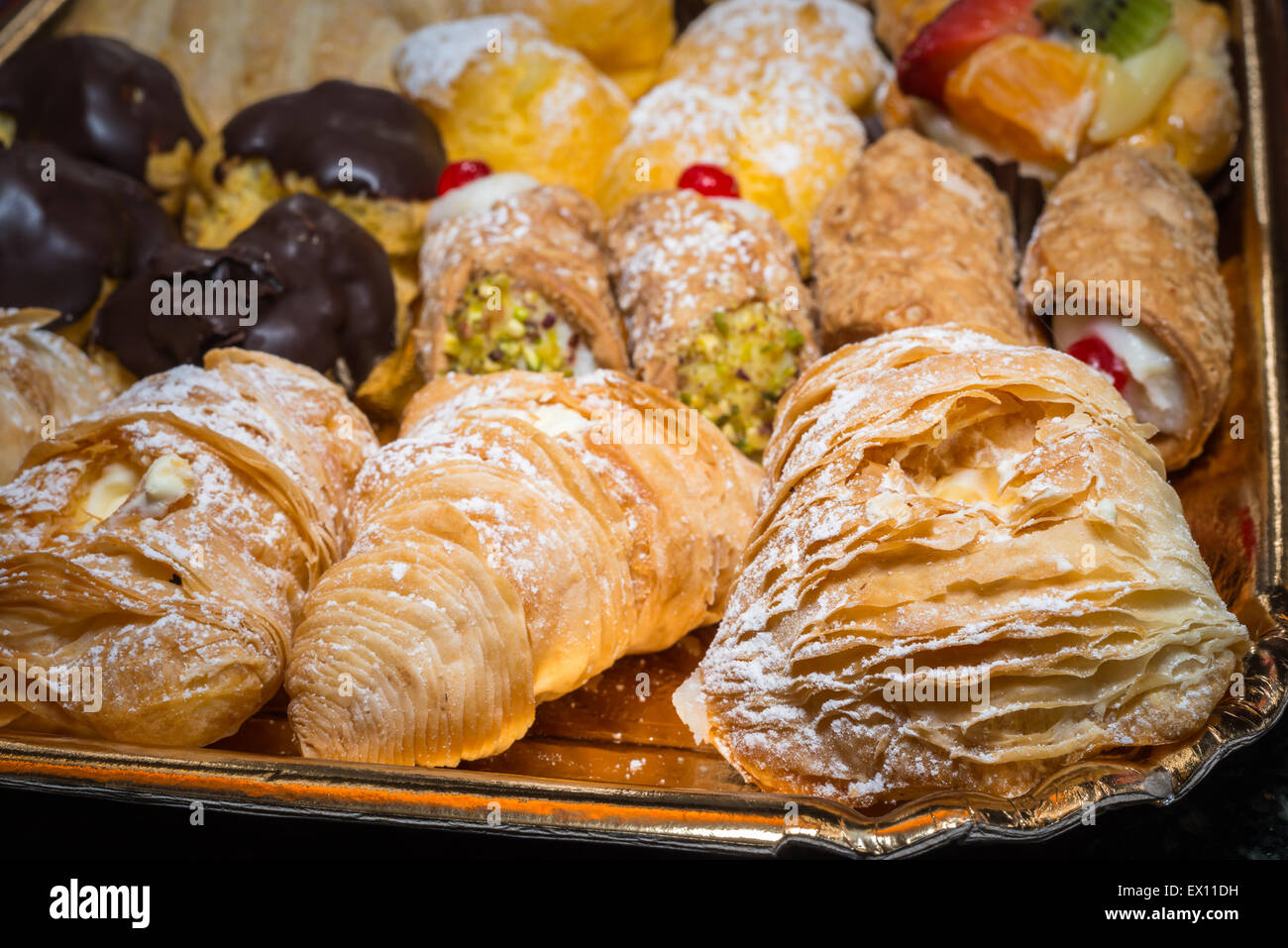 colorful pastries with fruits, cream and chocolate, the real Italian ...