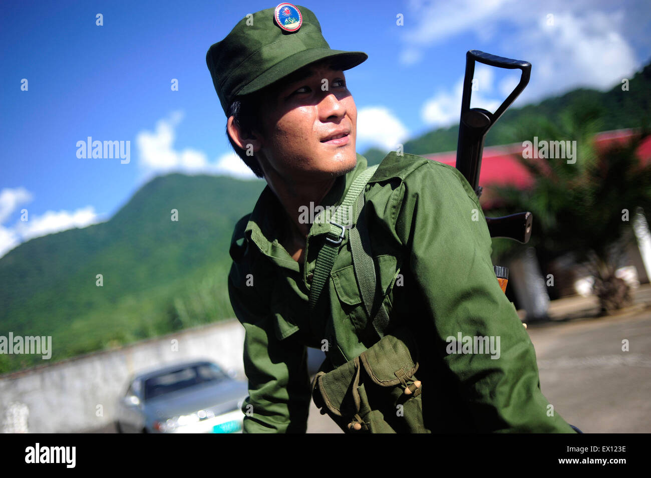 A Myanmar policeman patrols a street in Namteuk, neighbouring China's ...