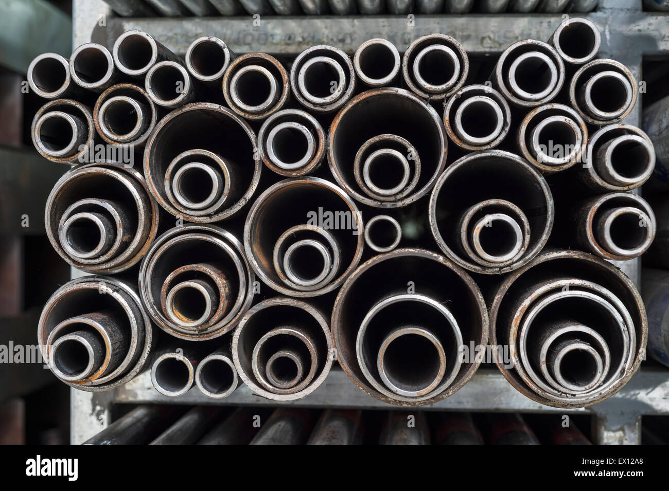 Steel pipes background Stock Photo - Alamy
