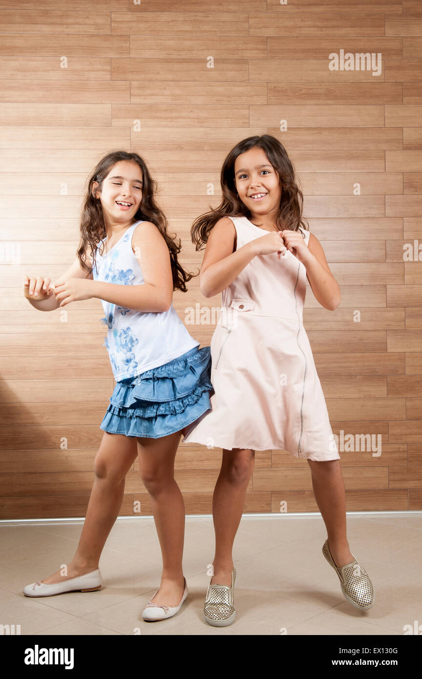 Two cute young girls playing Stock Photo - Alamy