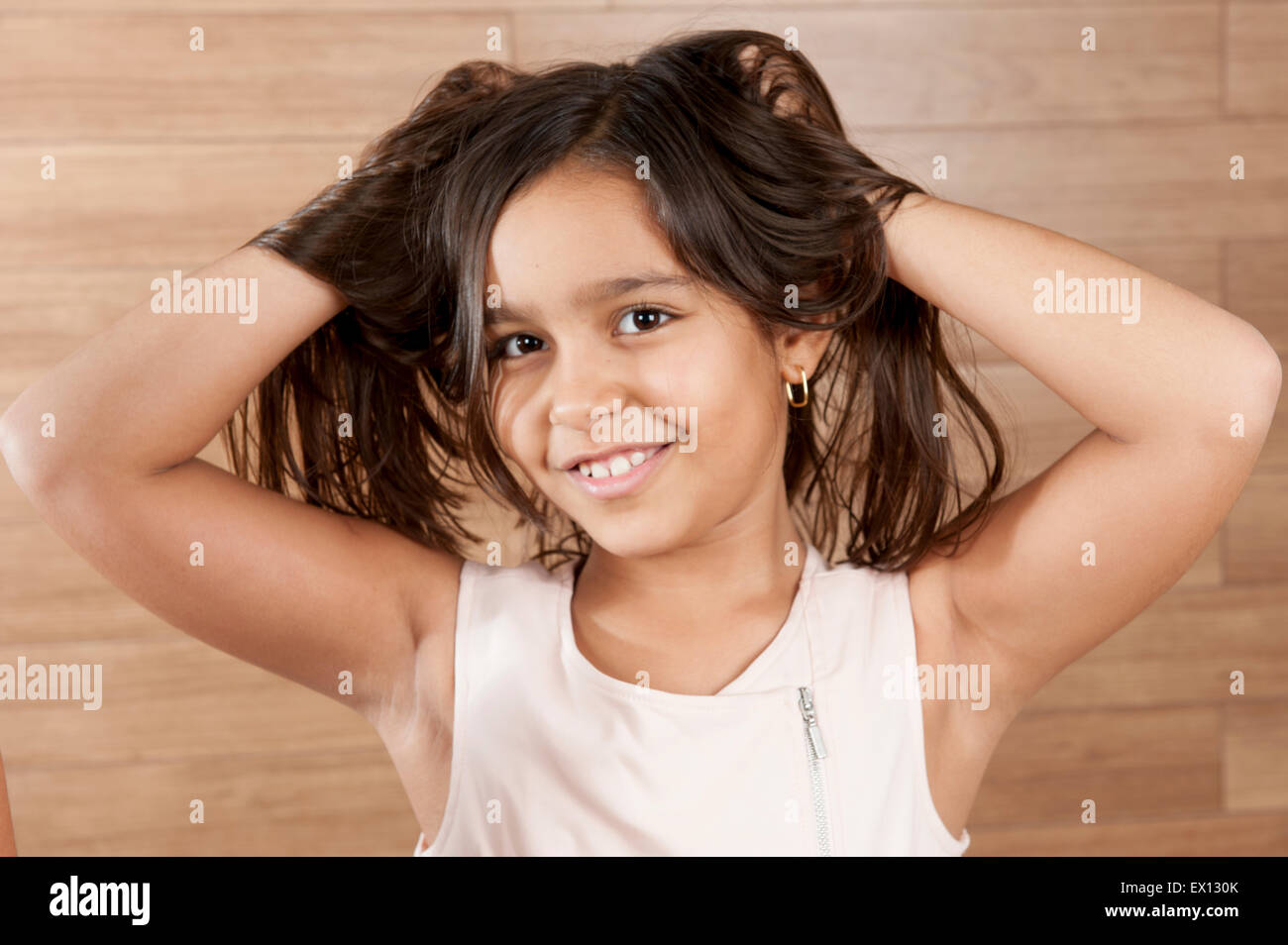 Cute young girl smilling, indoor photo Stock Photo - Alamy