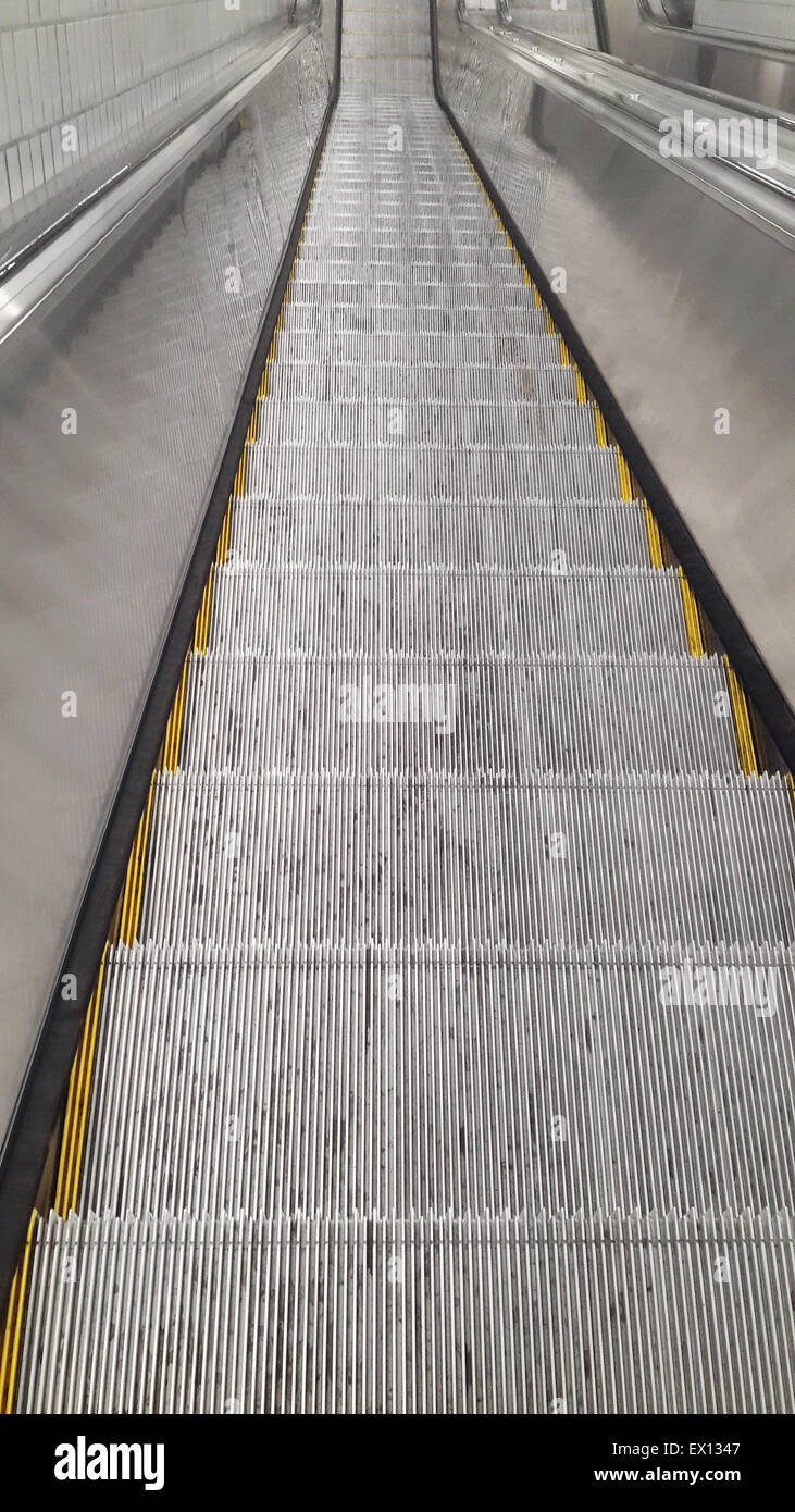 Long escalator inside a city building Stock Photo - Alamy