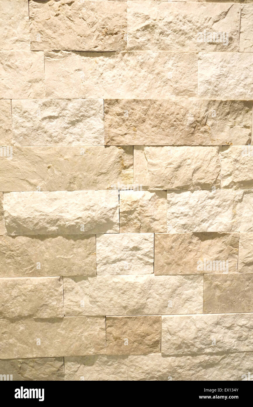 Cut stone wall as a background Stock Photo - Alamy