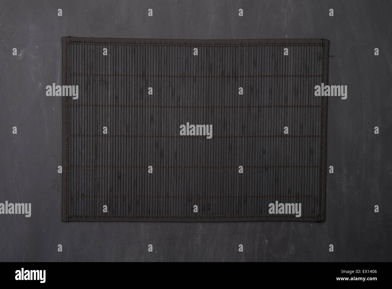 Bamboo place mat on wooden deck table Stock Photo - Alamy