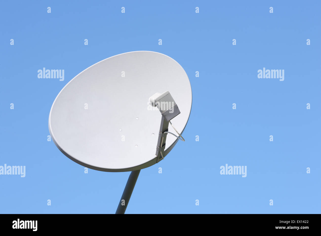 Wireless satellite dish with blue sky copy space Stock Photo - Alamy
