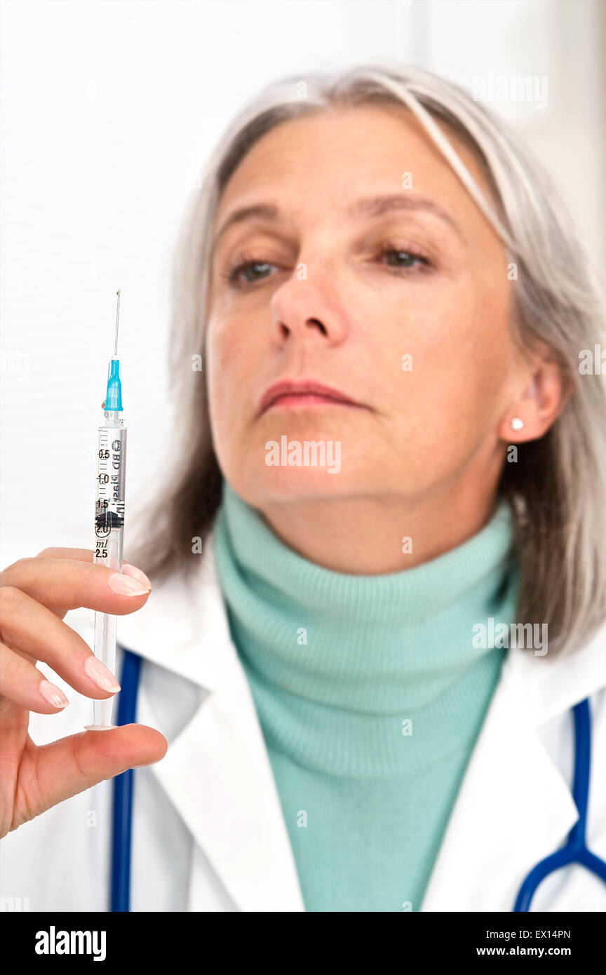 Female model holding injection hi-res stock photography and images - Alamy