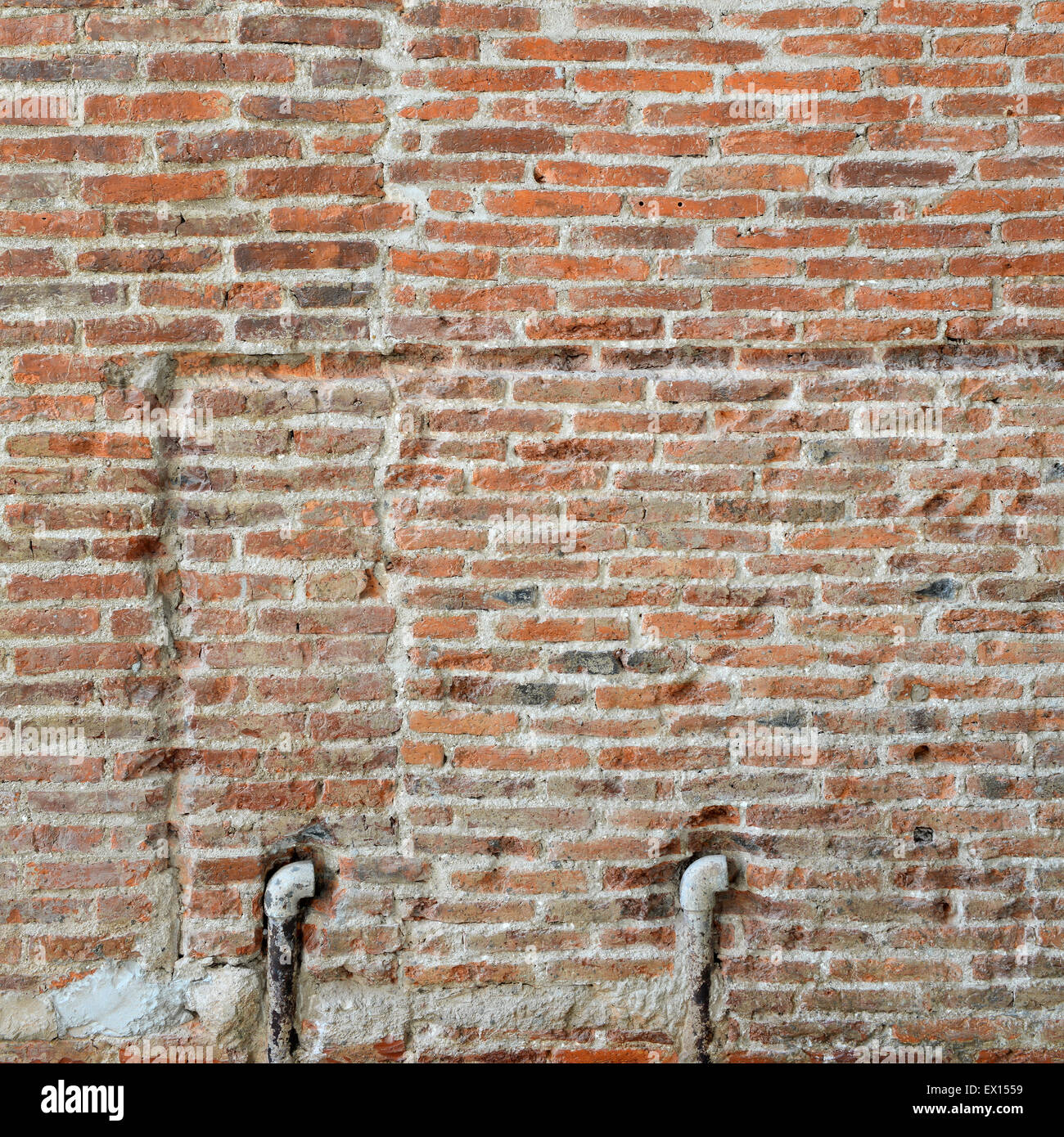 Old brick wall and pipe on concrete texture, background for decorate ...