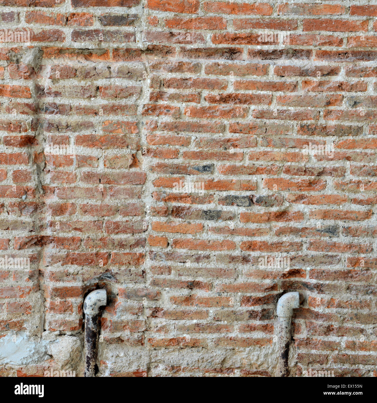 Old brick wall and pipe on concrete texture, background for decorate ...