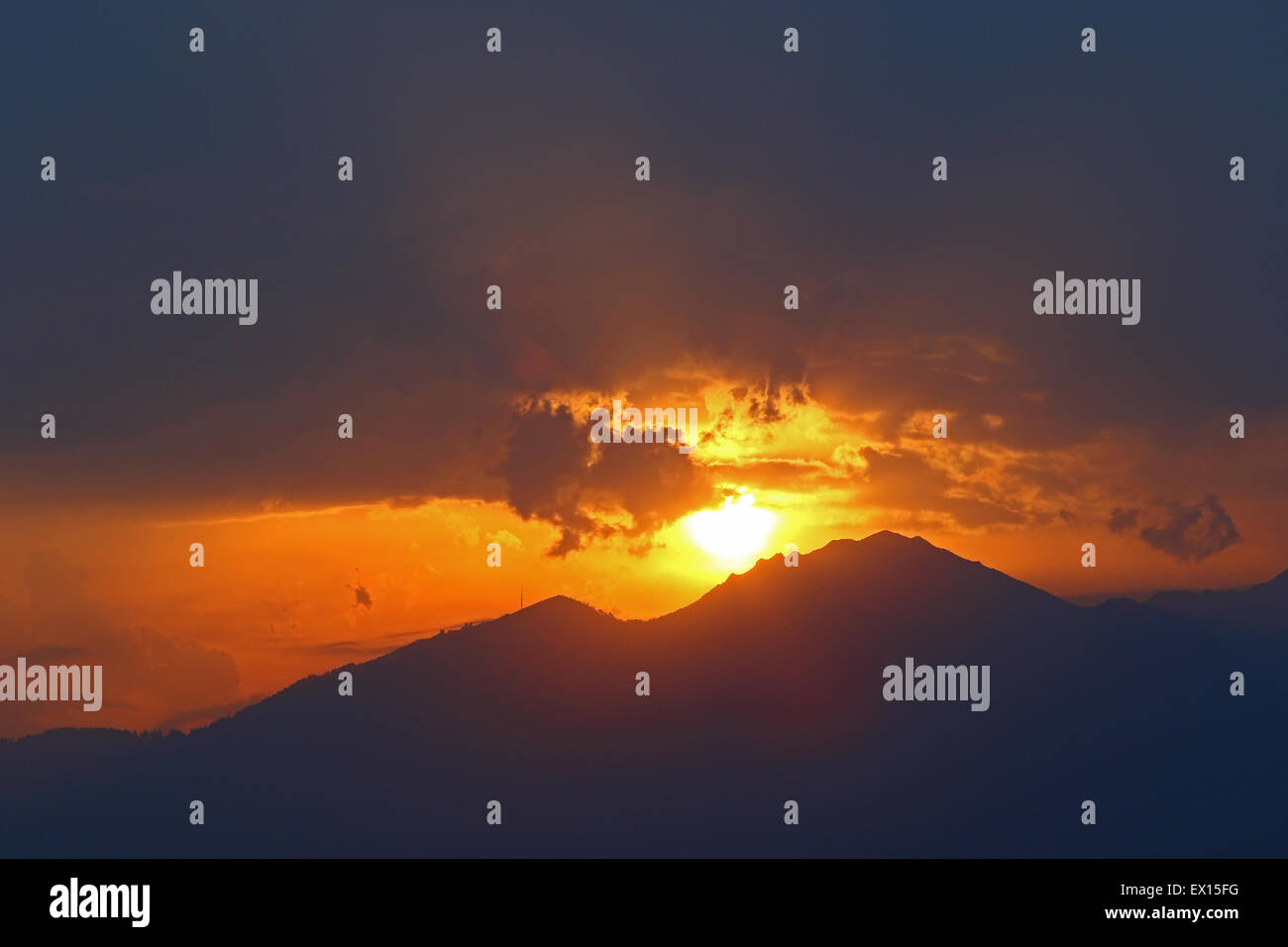 Storm clouds with sun peeking through hi-res stock photography and ...