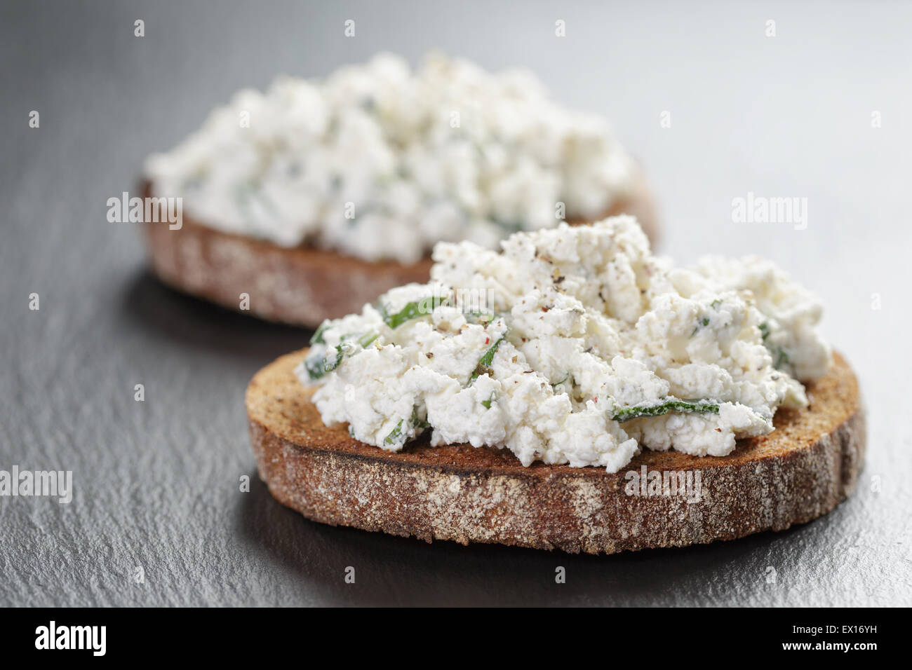rye sandwiches or bruschetta with ricotta cheese and herbs Stock Photo ...