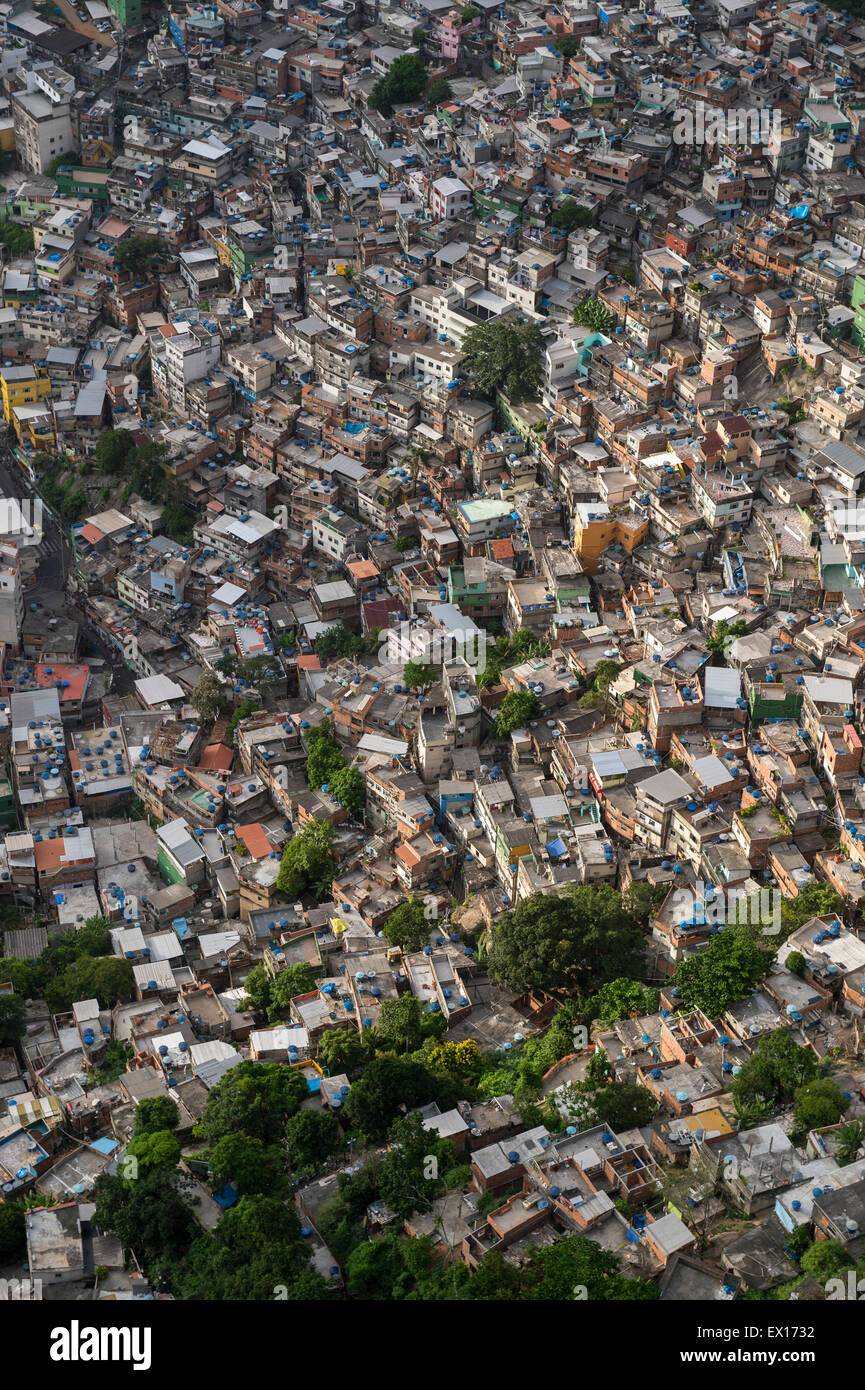 Crowded Brazilian Rocinha favela shanty town climbs a hillside in Rio ...