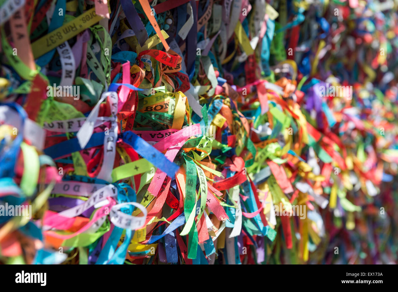 Colorful Brazilian wish ribbons tied to a fence at the Bonfim Church ...