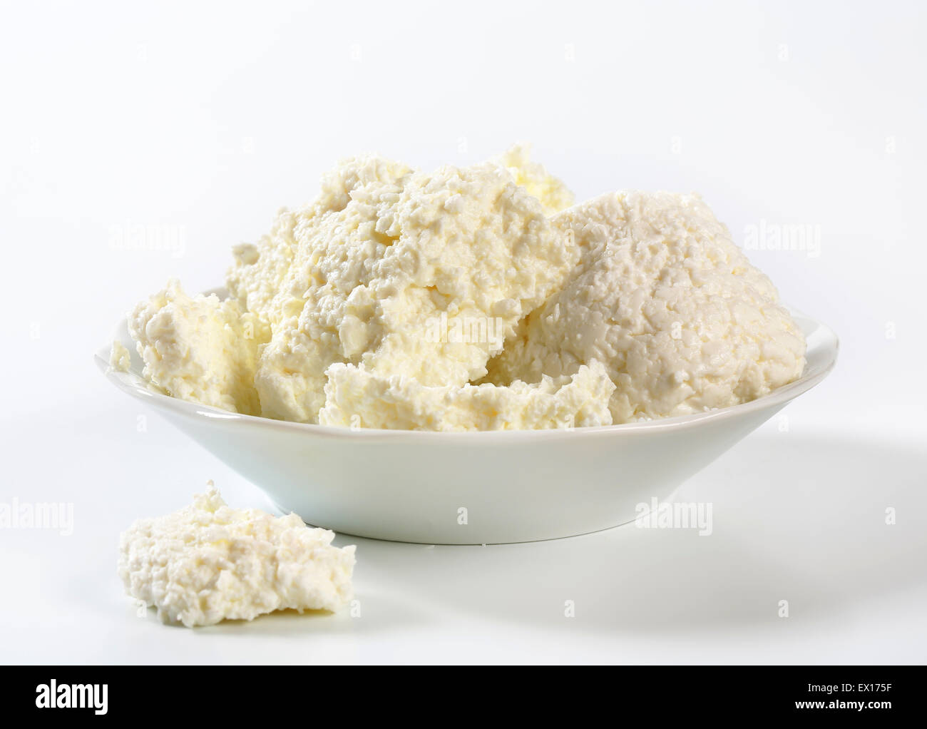 Bowl of white crumbly cheese Stock Photo - Alamy