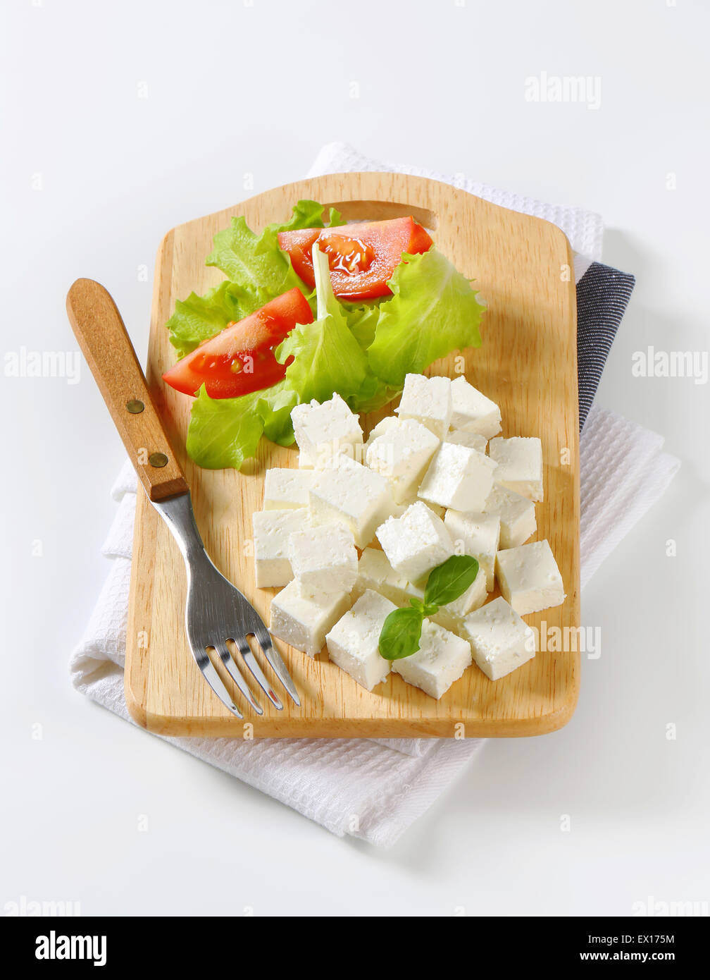 Cubes of feta cheese on a plate Stock Photo - Alamy