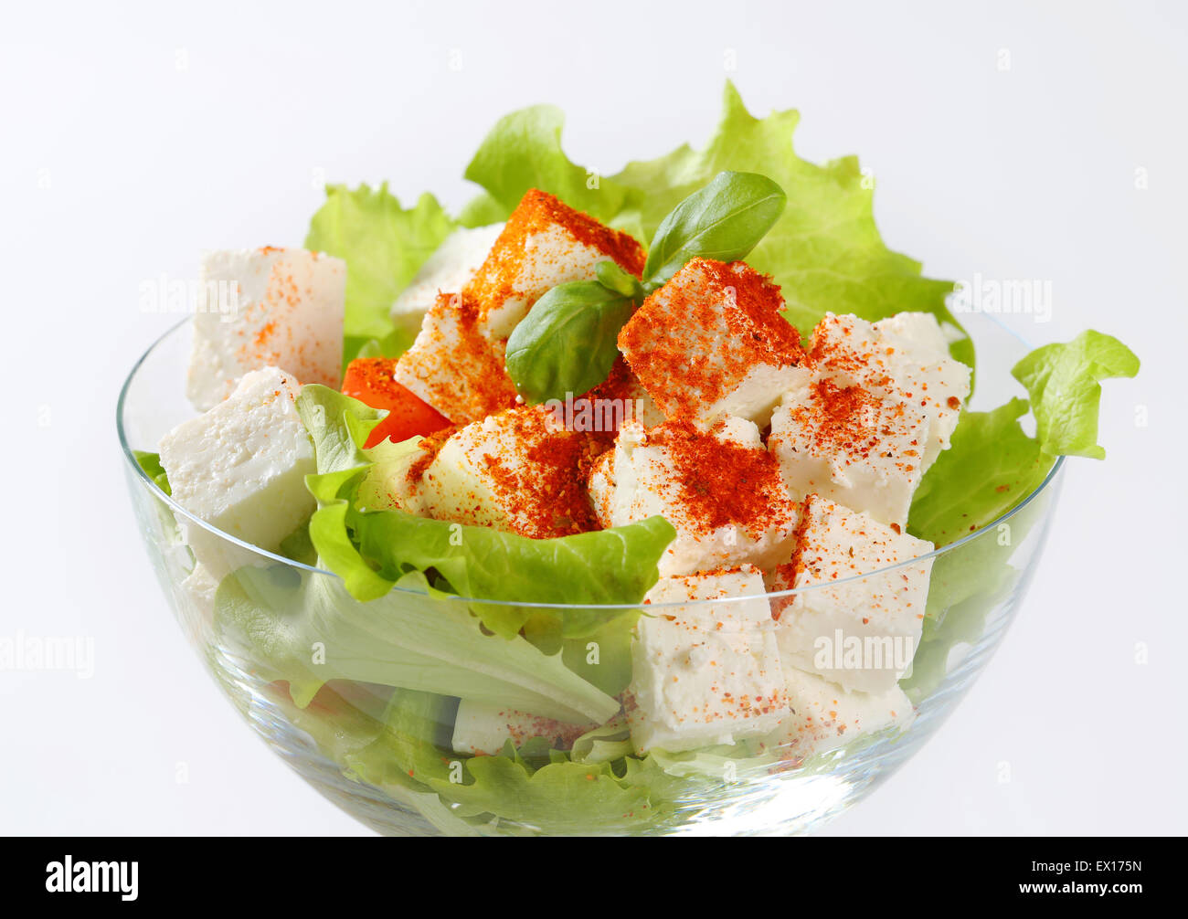 Diced feta cheese with fresh vegetable salad Stock Photo - Alamy