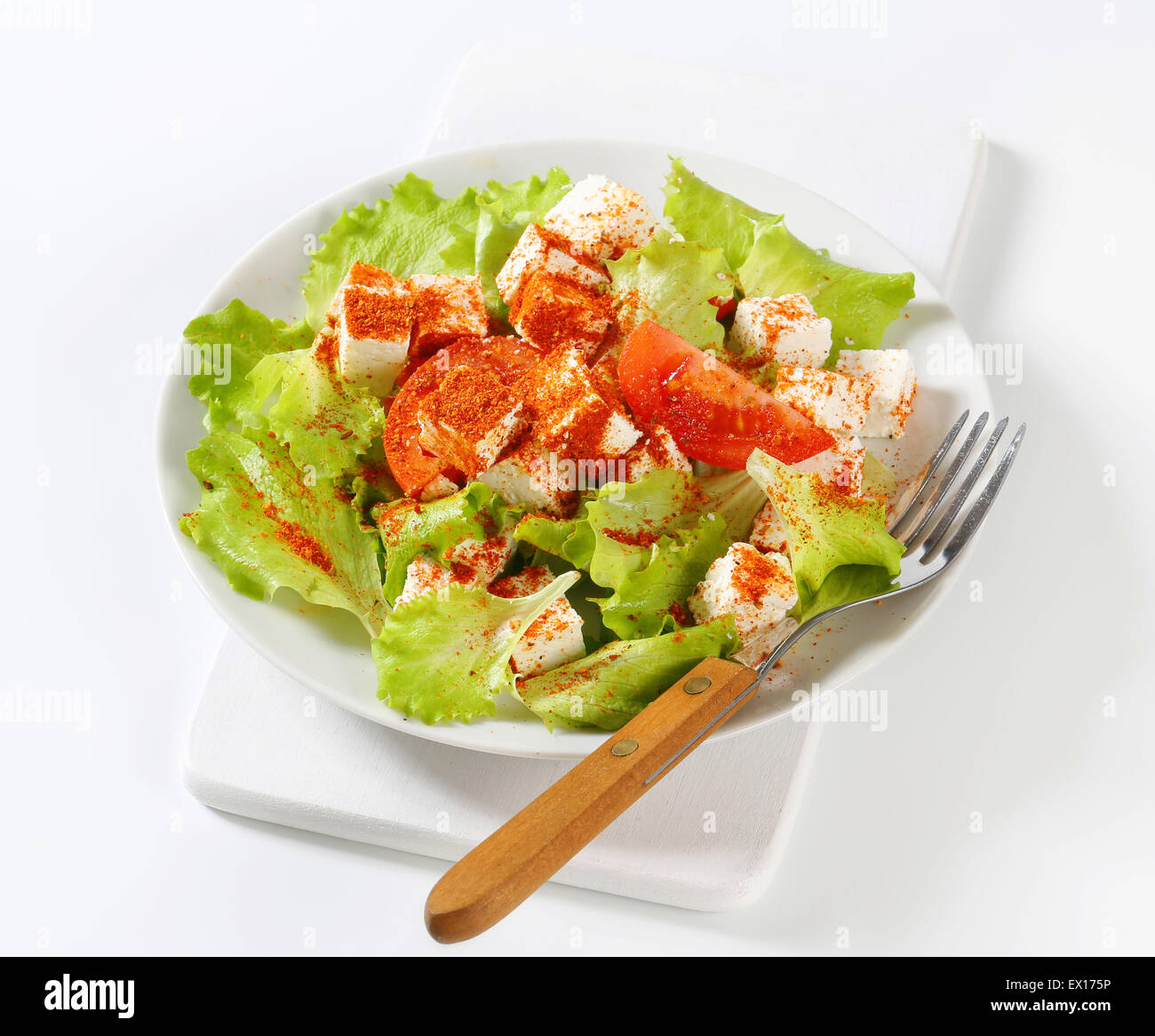 Diced feta cheese with fresh lettuce and tomatoes Stock Photo - Alamy