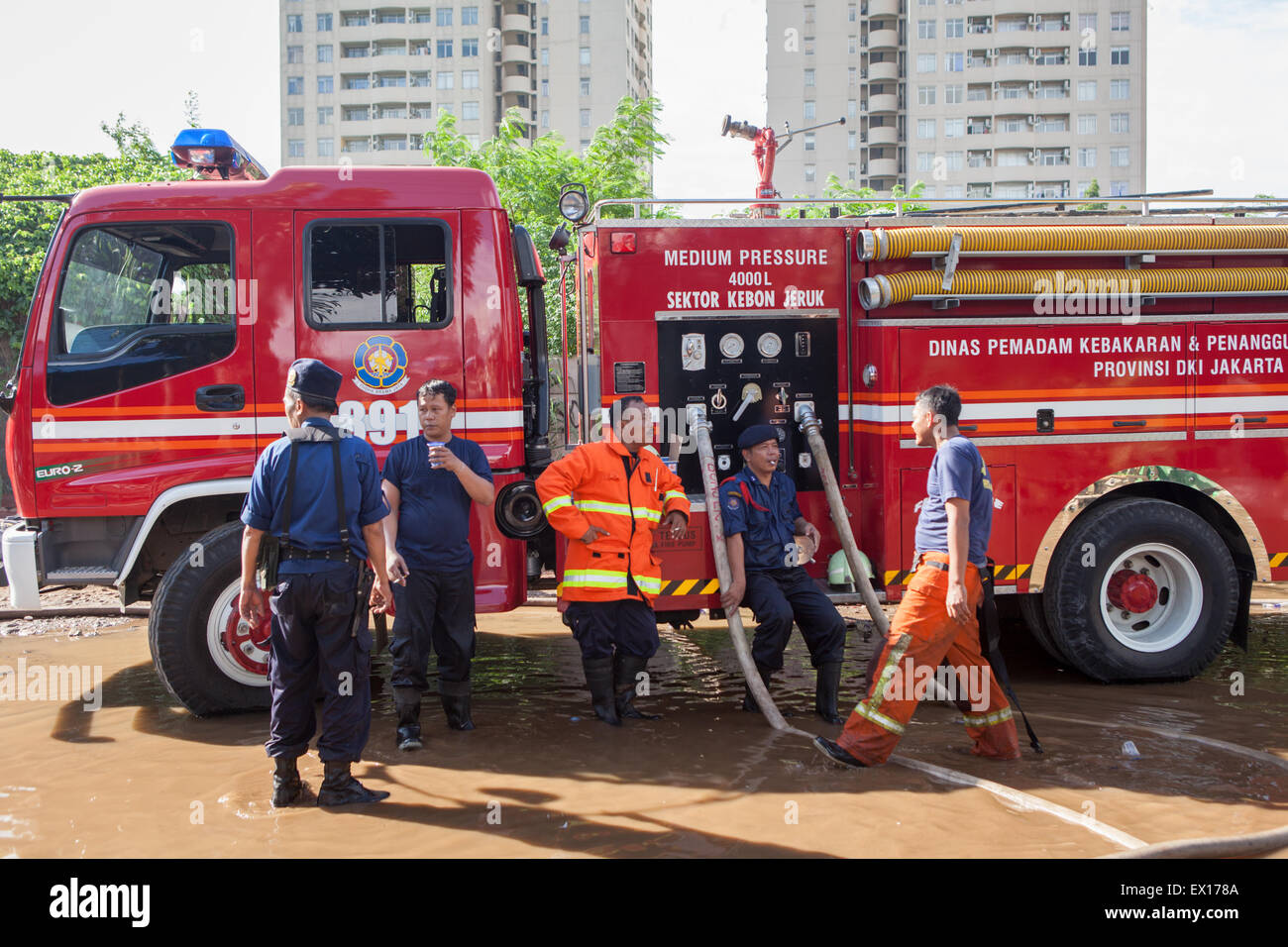 Members of Jakarta firefighting squad having a conversation on the side ...