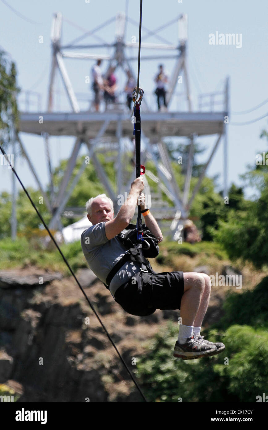 Vancouver, Canada. 3rd July, 2015. A tourist rides on a zipline at the ...